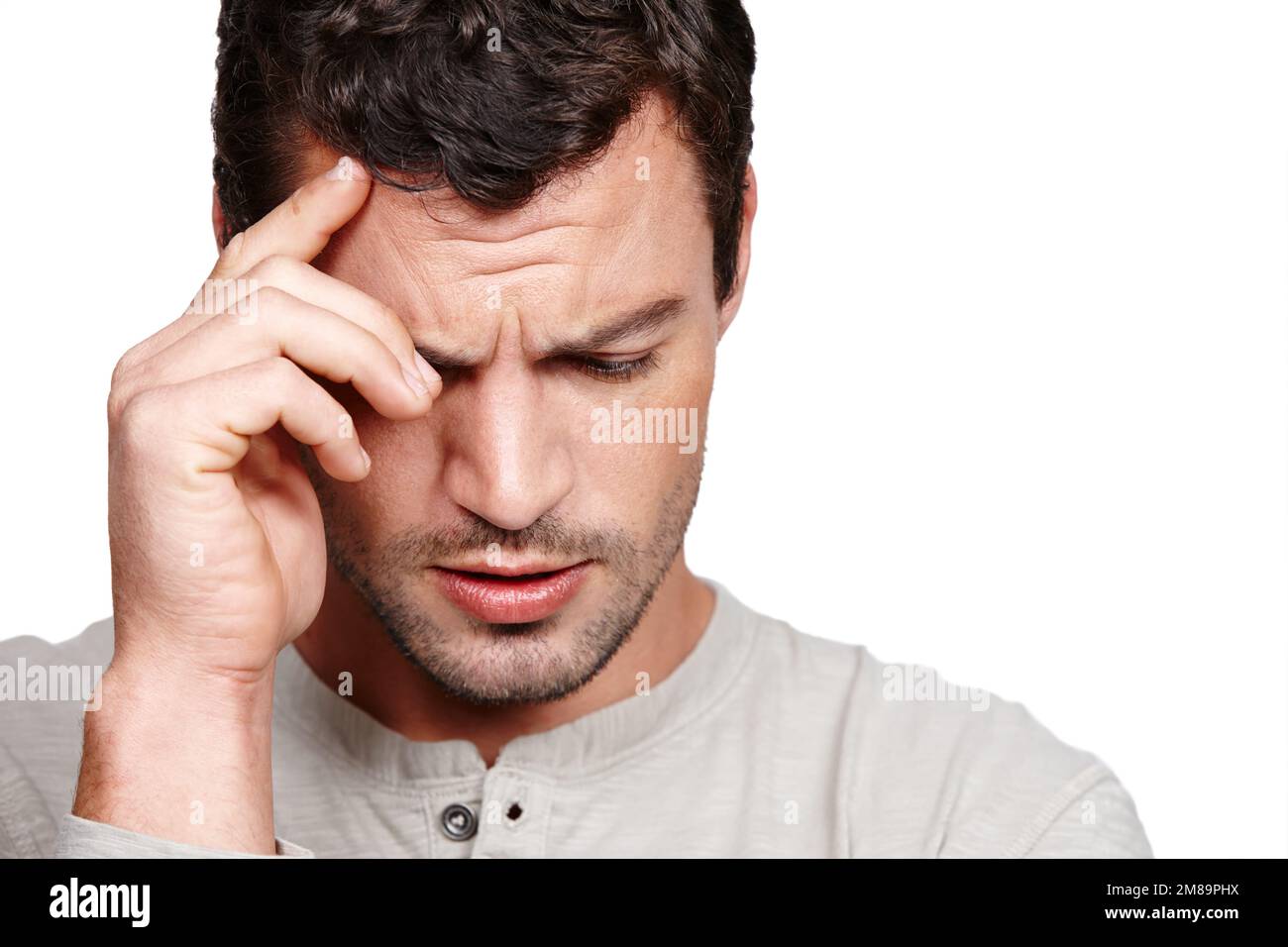 Man, headache and stress face in studio for depression, mental health ...