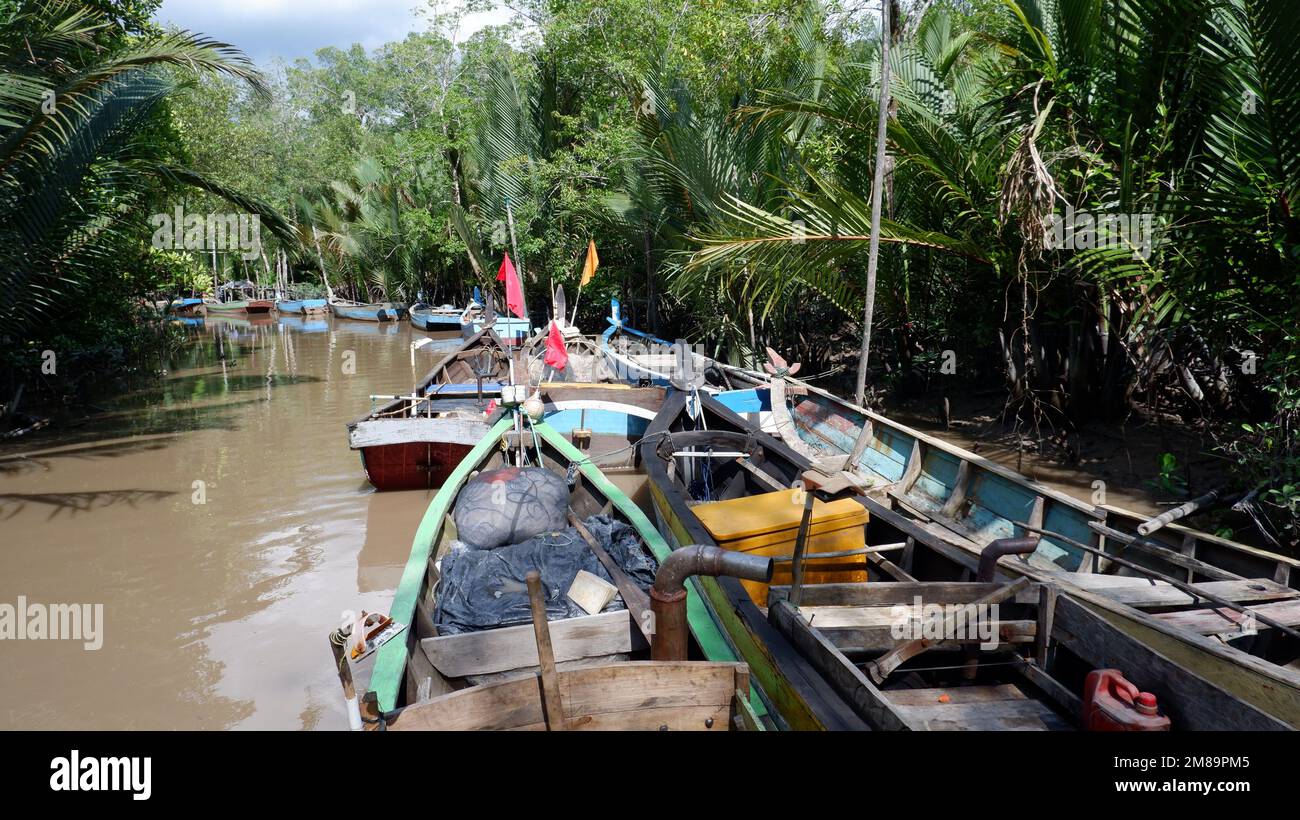 Fishing Boats In Group, Indonesian Rural River Port Stock Photo - Alamy