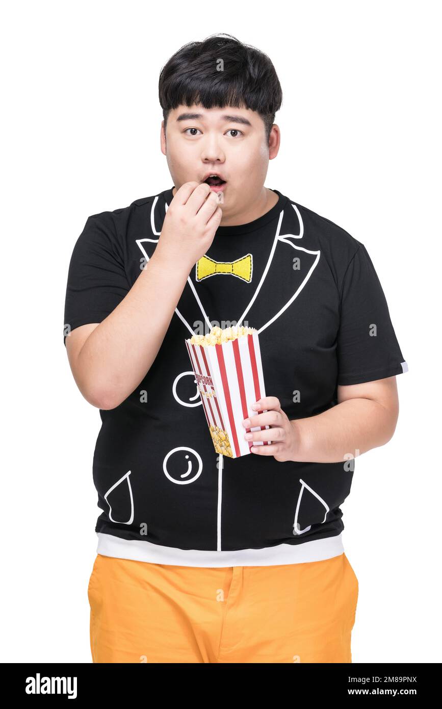 Take the fat young men popcorn Stock Photo - Alamy