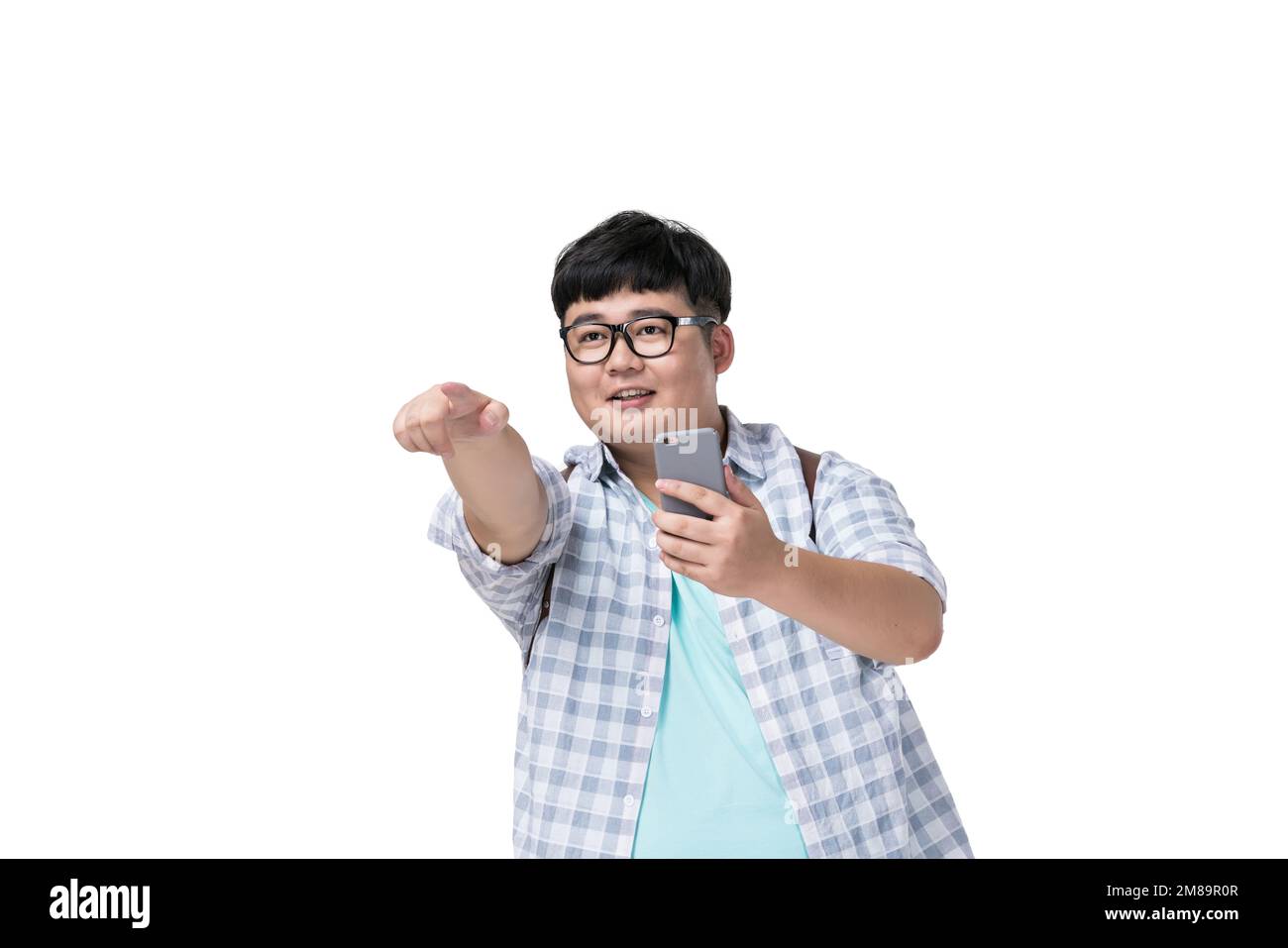 Fat young men in using a mobile phone to find the way Stock Photo - Alamy