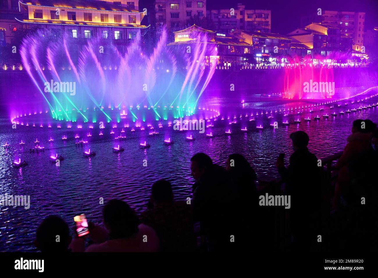 People watch music fountain in Xuan'en County, Enshi Tujia and Miao ...