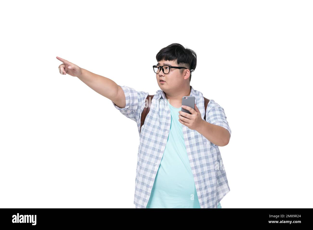 Fat young men in using a mobile phone to find the way Stock Photo - Alamy