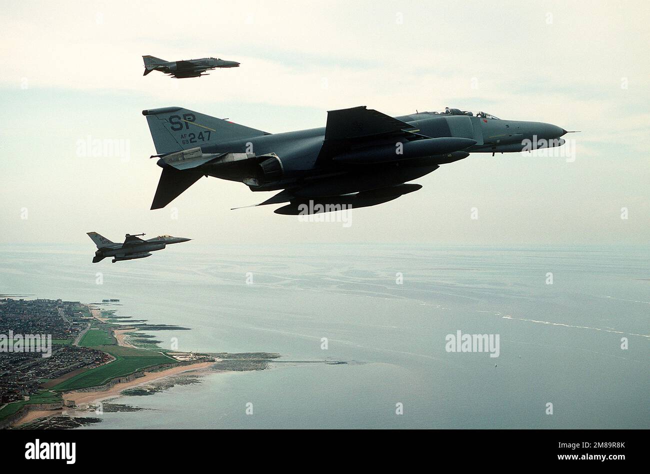 An air-to-air right side view of two F-4G Phantom II "Wild Weasel ...