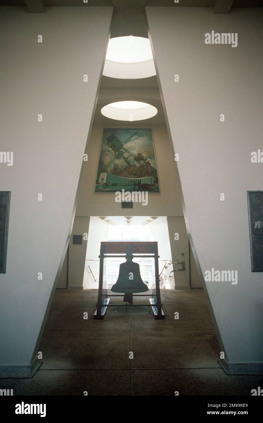 A view of the ship's bell and a mural displayed inside the USS ARIZONA ...