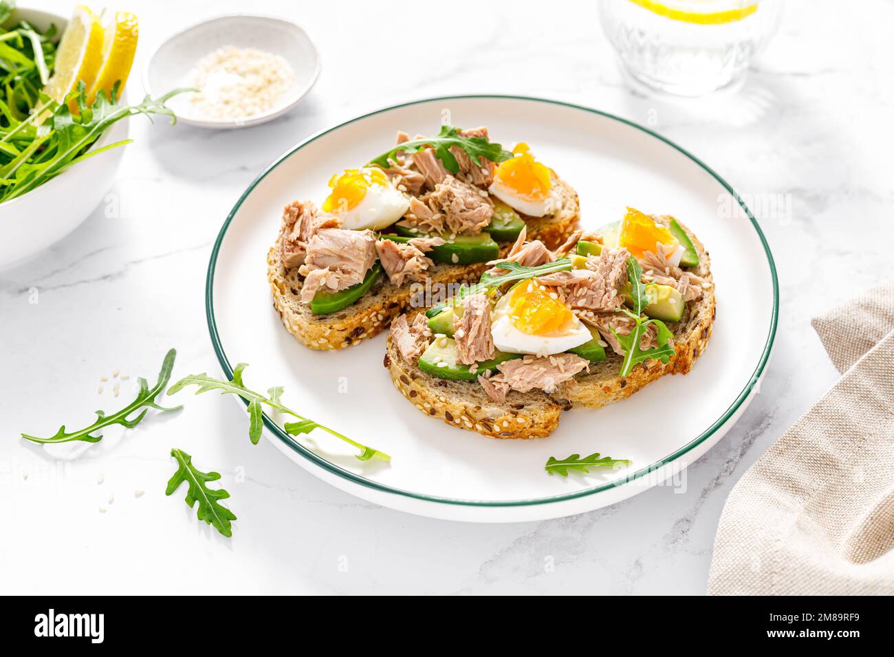 Tuna toast. Open sandwiches with whole grain bread, canned tuna, boiled ...