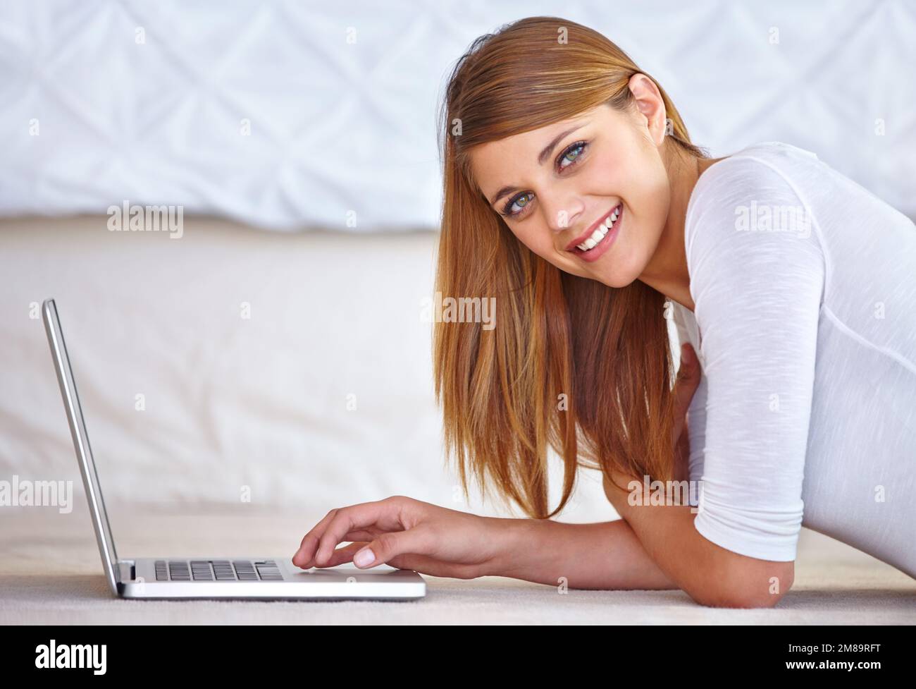 Shes always connected. Portrait of an attractive young woman using a ...