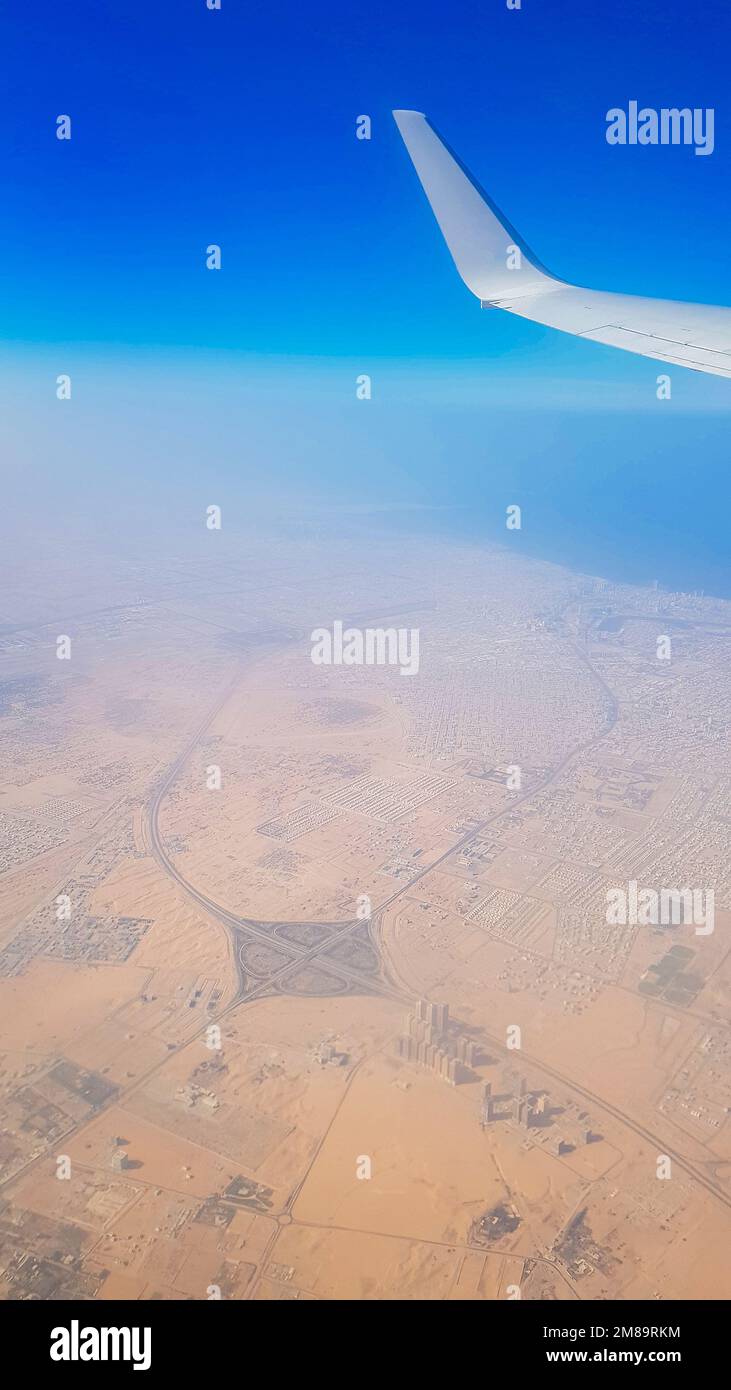 View from the window of plane on blue sky and earth with landscape of ...