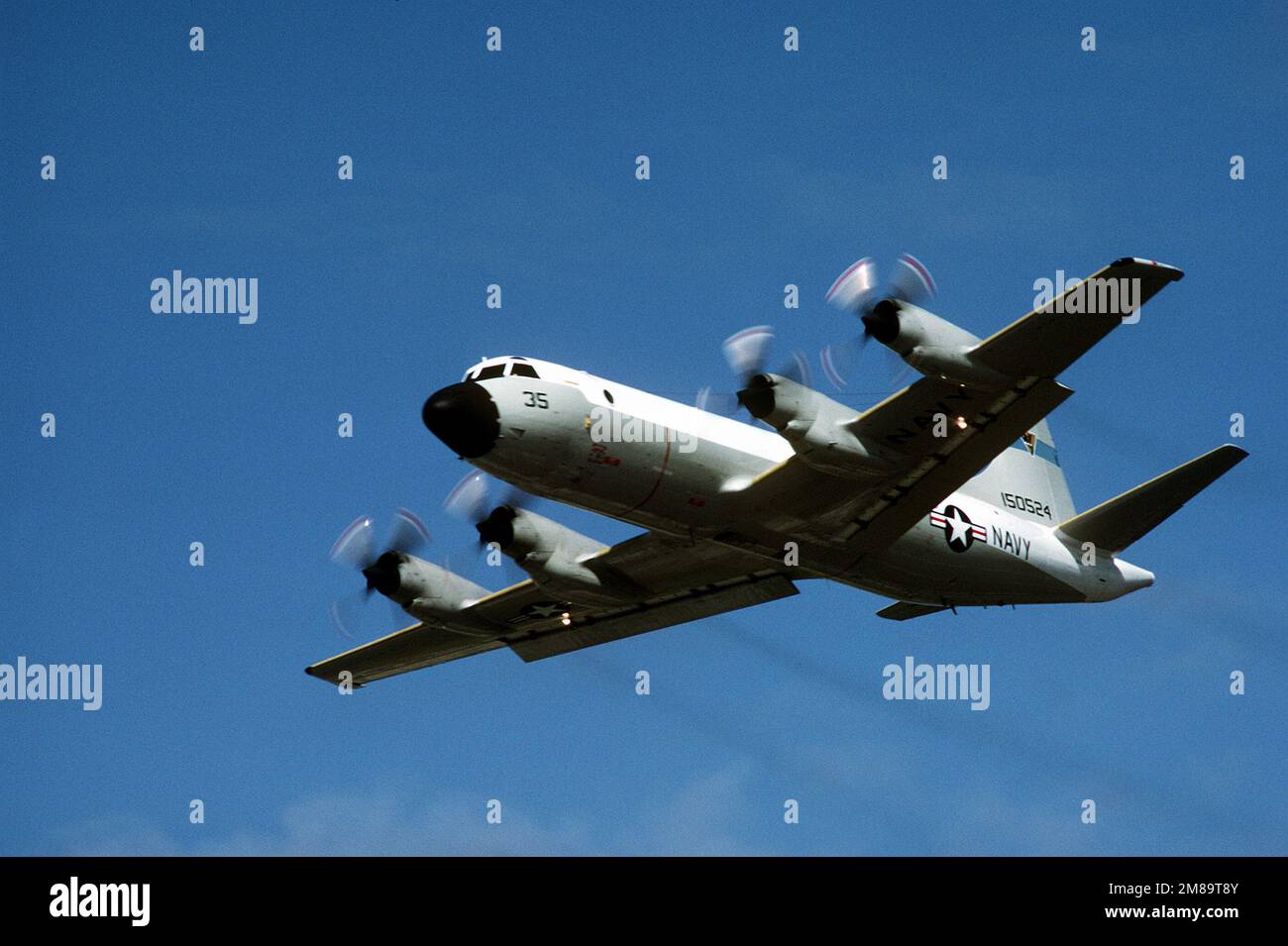 A left front view of a P-3 Orion patrol aircraft taking off. Base ...