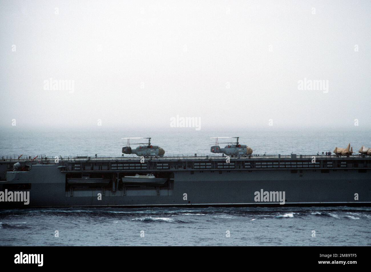 A view of Ka-27 Helix helicopters and covered Yak-36 Forger aircraft on ...