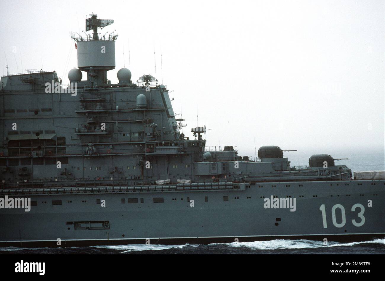 A starboard view of the superstructure, radar equipment, and 100mm dual ...