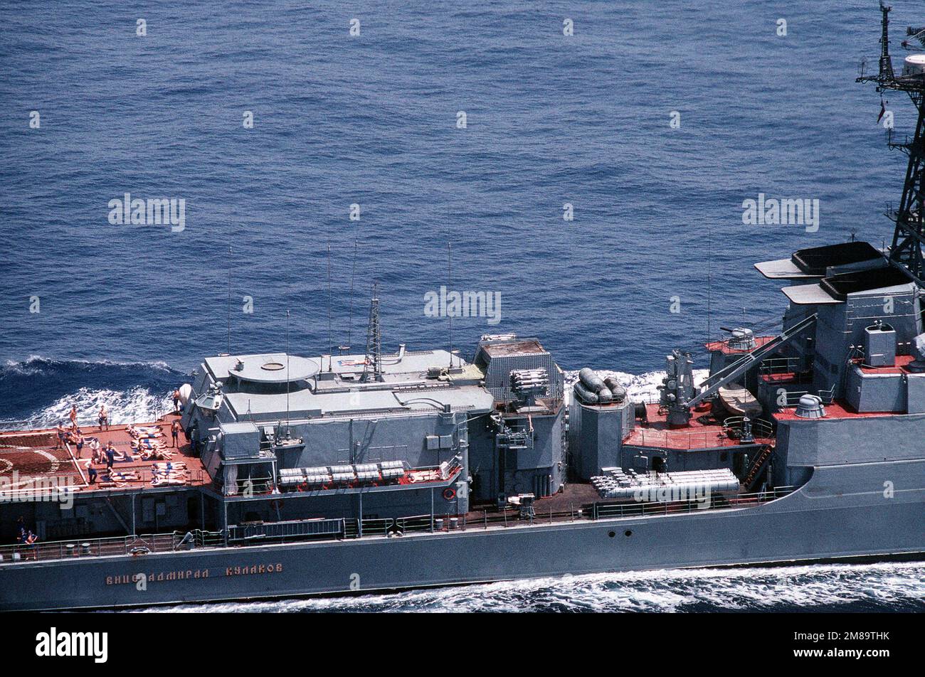 A view of the helicopter hangars and helicopter pad, with crewmen ...