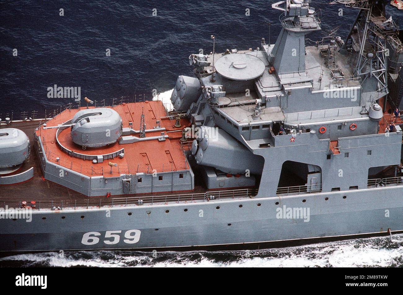 A view of 100mm dual purpose guns and SS-N 14 missile tubes aboard the ...