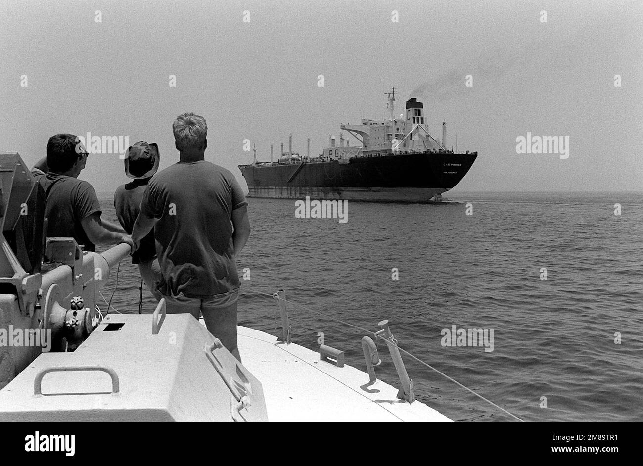 Members of Special Boat Unit 11 observe the SS GAS PRINCE from the bow ...