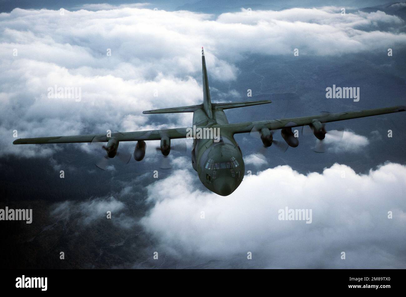 An air-to-air front view of a C-130E Hercules aircraft of the 36th ...