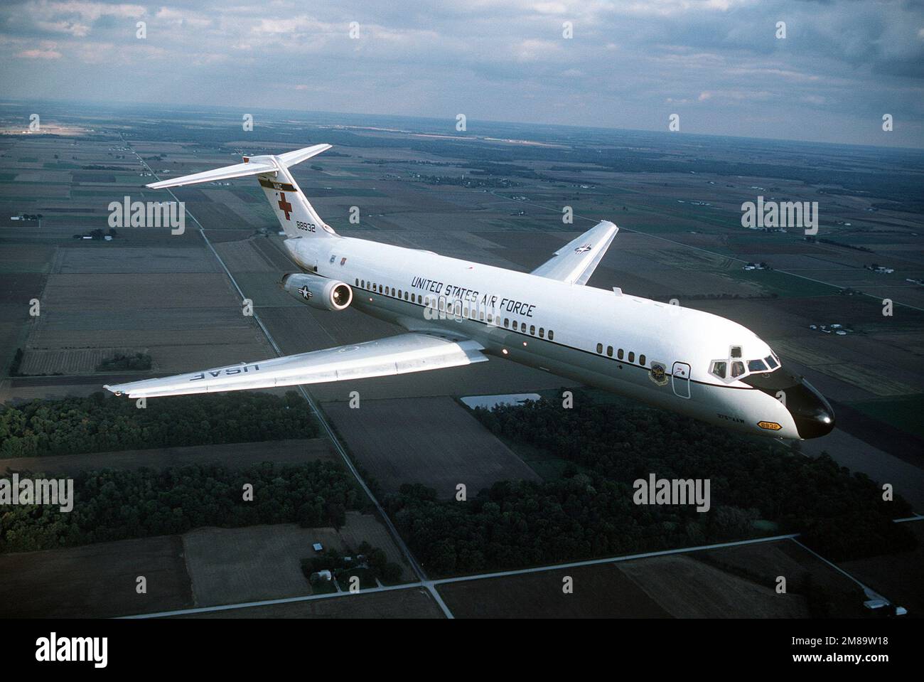 An air-to-air right front view of a C-9A Nightingale aircraft of the ...