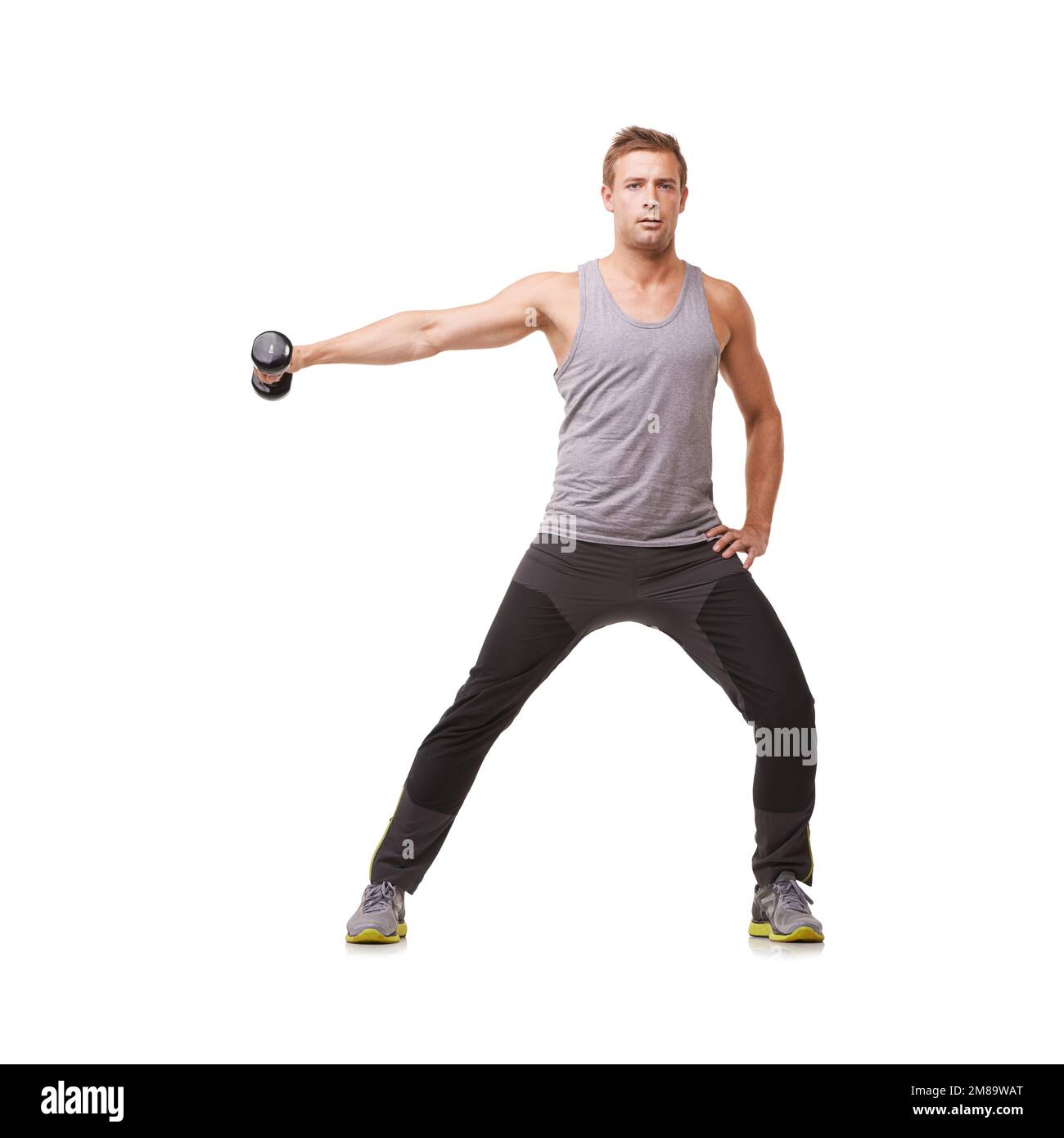 Exercise is a part of his daily routine. A fit young man doing lateral ...