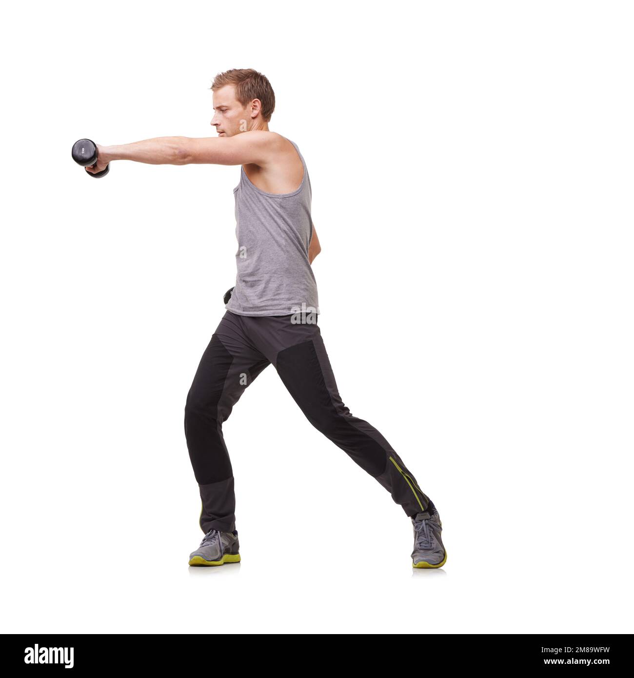 Cardio and strength training. A fit young man punching with his ...