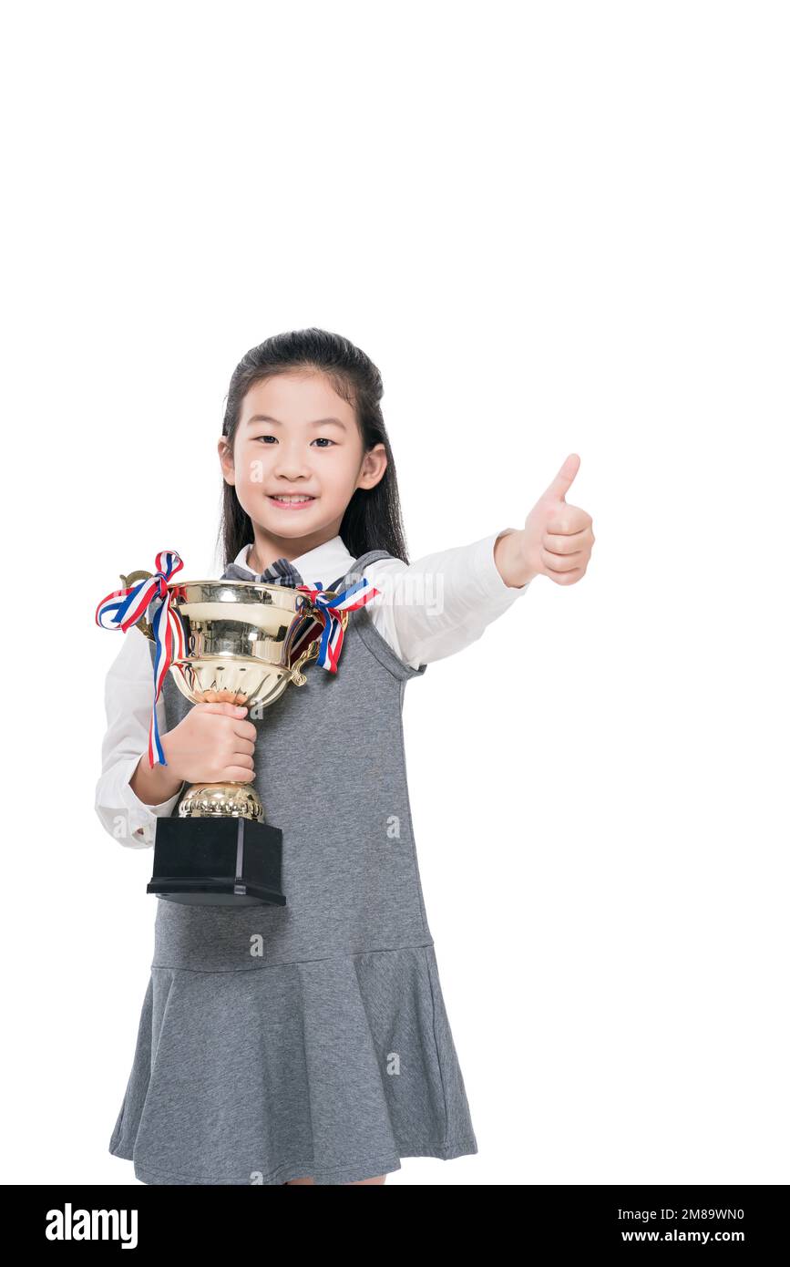 Happy primary school students holding a trophy Stock Photo - Alamy