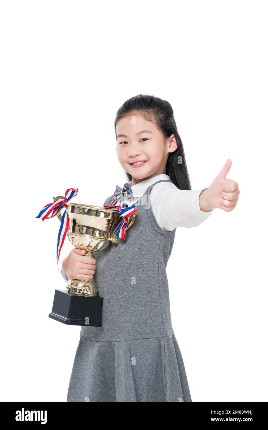 Happy primary school students holding a trophy Stock Photo - Alamy