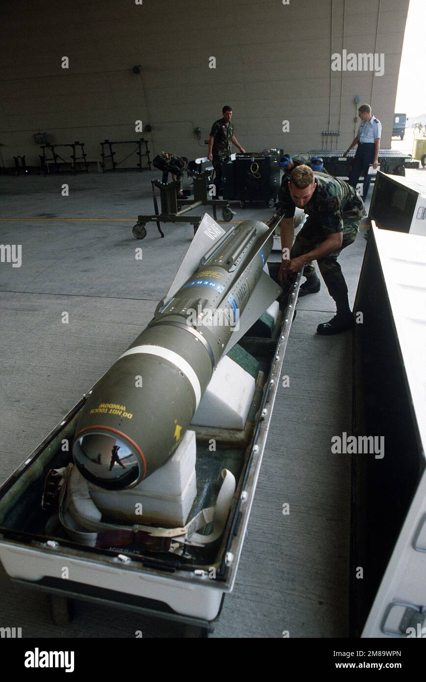 An airman prepares an inert AGM-65D Maverick missile for removal from ...