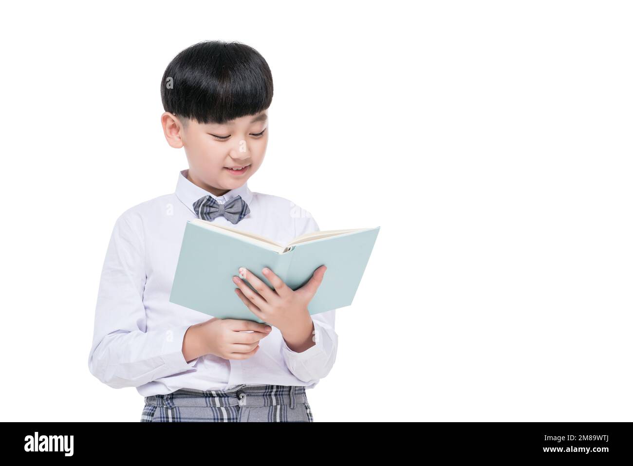 Happy primary school students in reading Stock Photo - Alamy