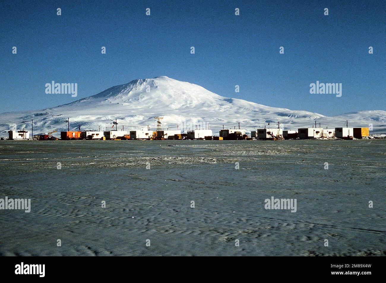 Mount Erebus overshadows the ice runway facility near McMurdo Station ...