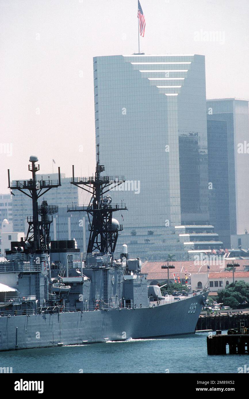 High-rise buildings tower over the destroyer USS CUSHING (DD-985). Base ...