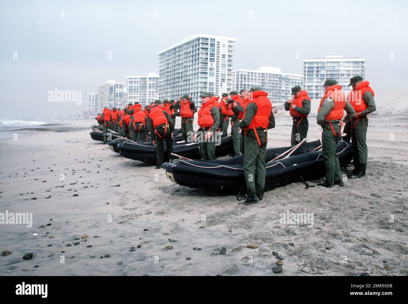 Students prepare to carry rubber rafts into the surf at Coronado Beach ...