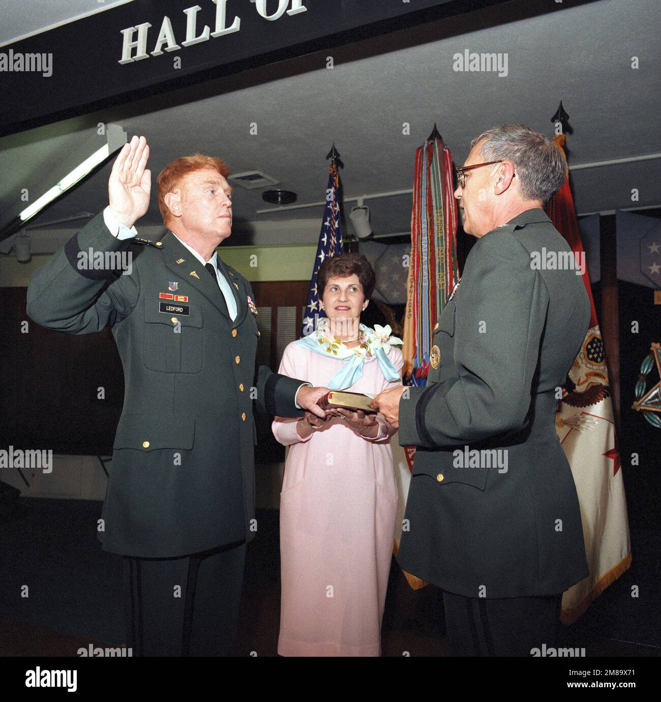 As his wife, Marilyn, holds the Bible, Lieutenant General Frank F ...