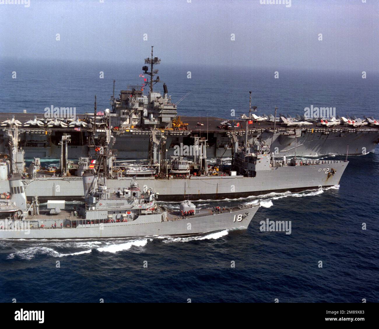 A starboard view of, from left: the guided missile destroyer USS SEMMES ...