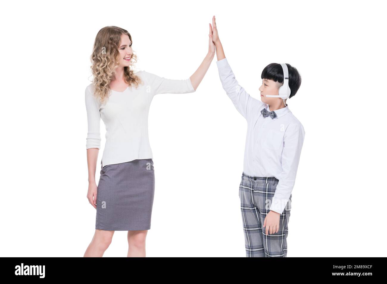 Female teachers and pupils hand-clapping Stock Photo - Alamy