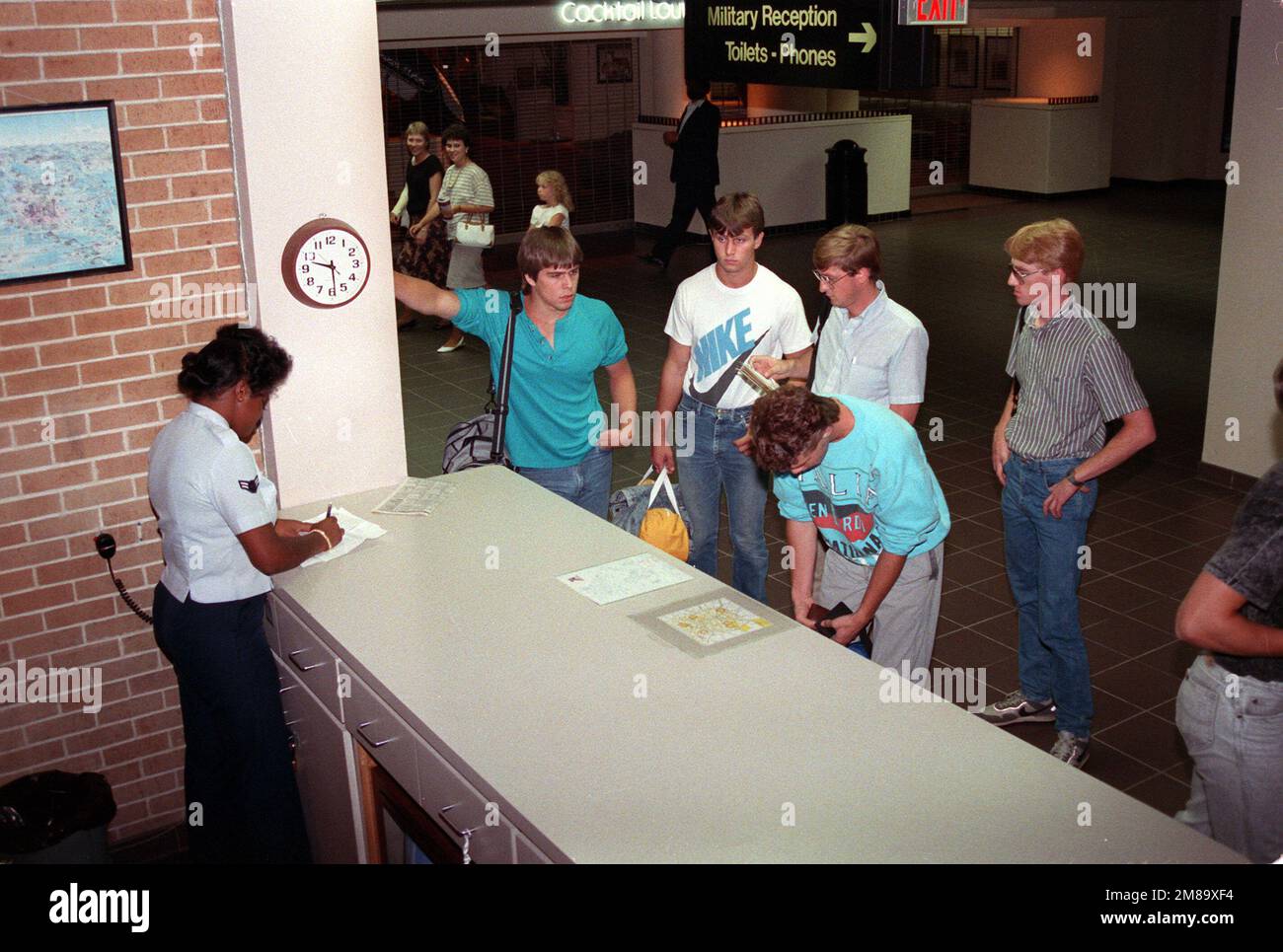 New recruits check in at the military reception desk at San Antonio ...