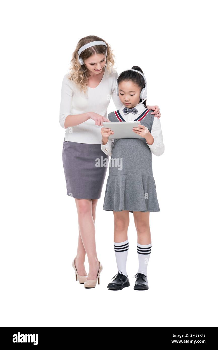 Female teachers guide students learning Stock Photo - Alamy