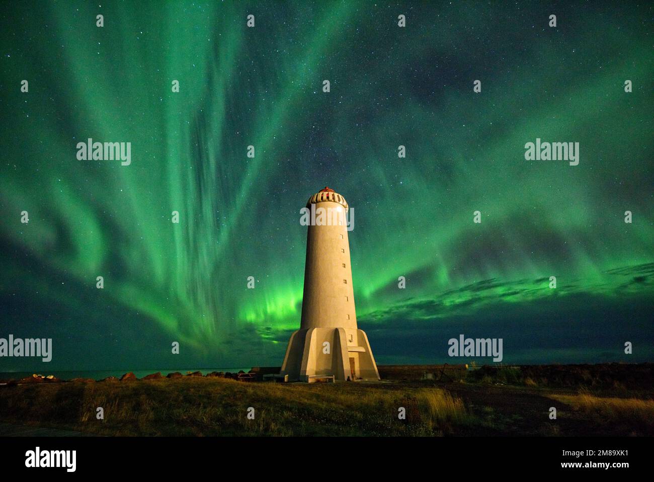 Aurora borealis (Northern Lights) above the Akranes lighthouse, Iceland ...