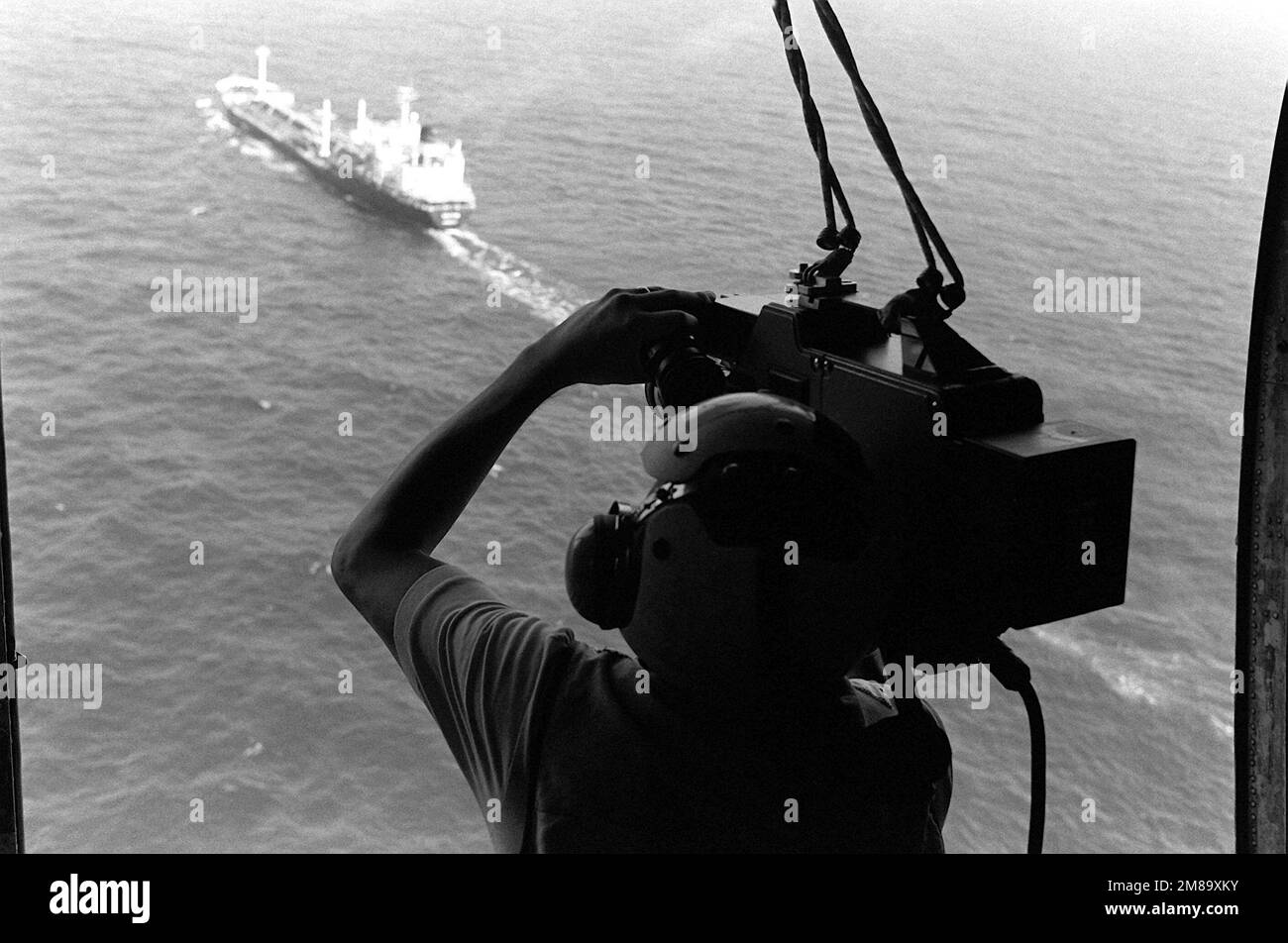 Civilian television cameraman Steve Cocklin videotapes a tanker ...