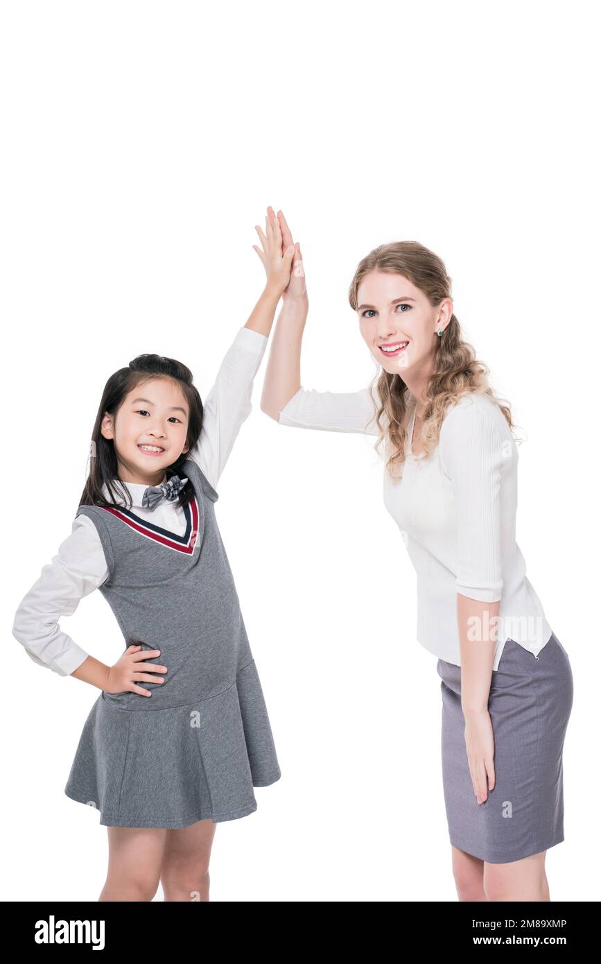 Female teachers and pupils hand-clapping Stock Photo - Alamy