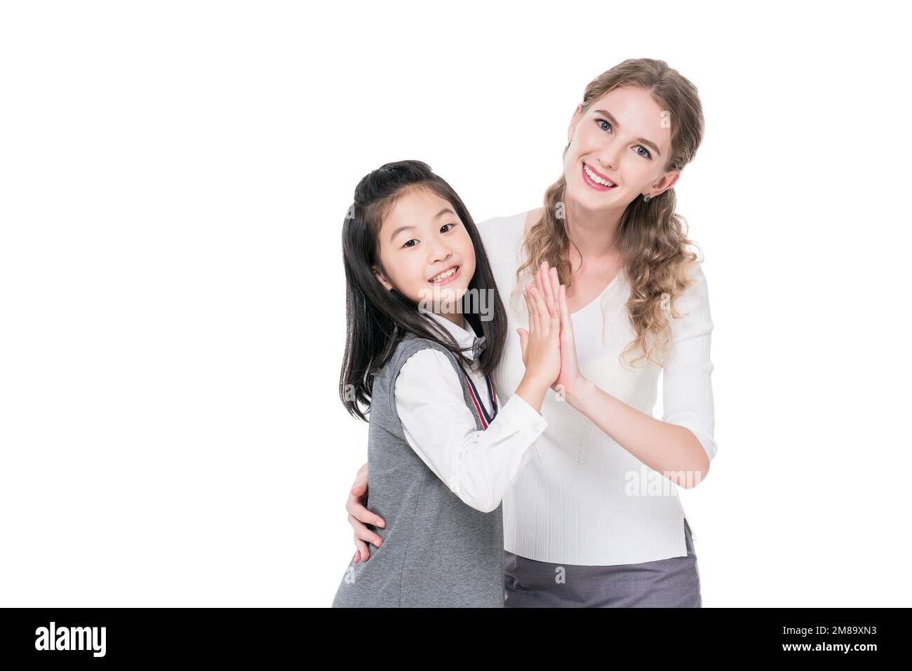 Female teachers and pupils hand-clapping Stock Photo - Alamy