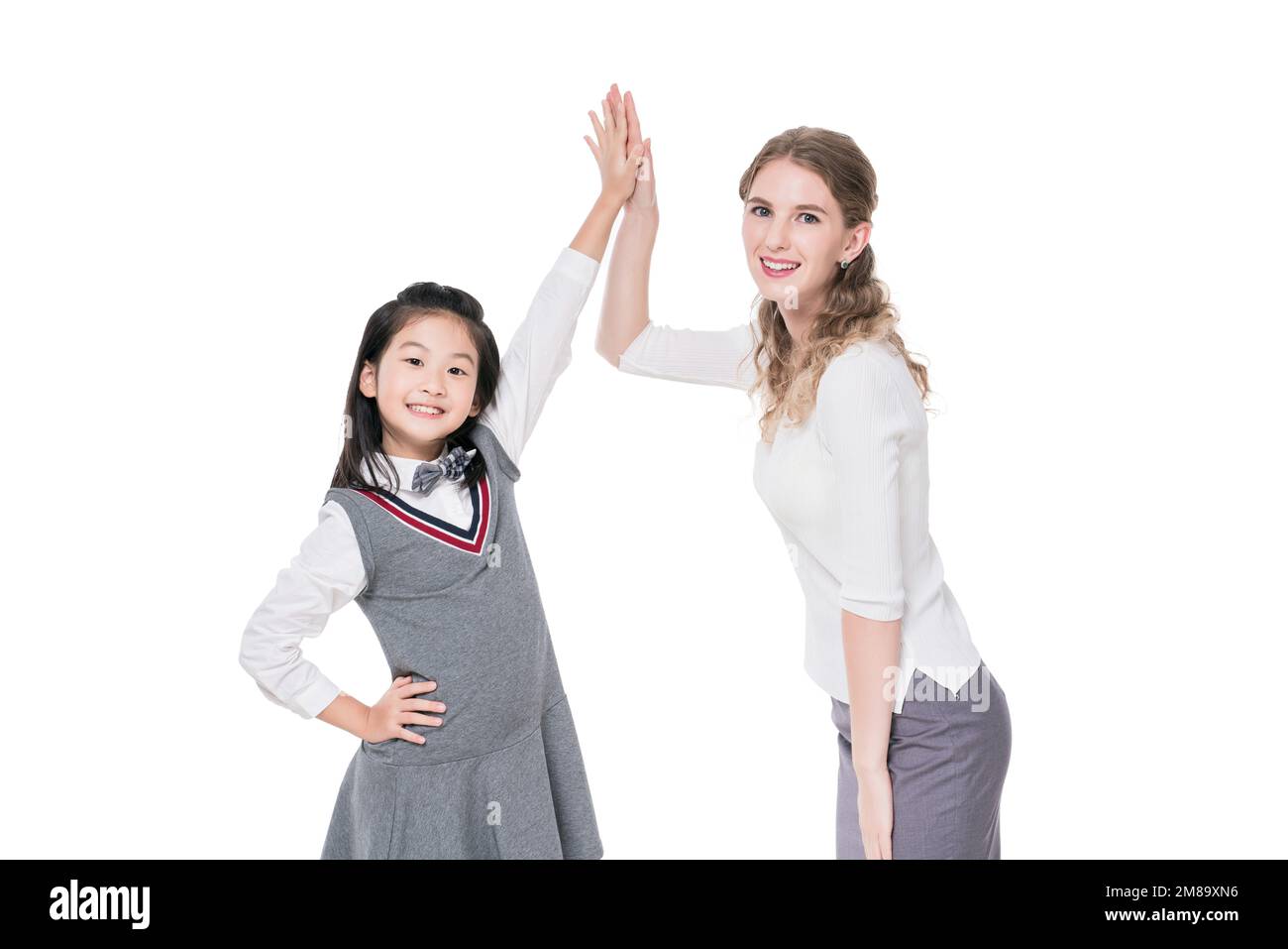 Female teachers and pupils hand-clapping Stock Photo - Alamy