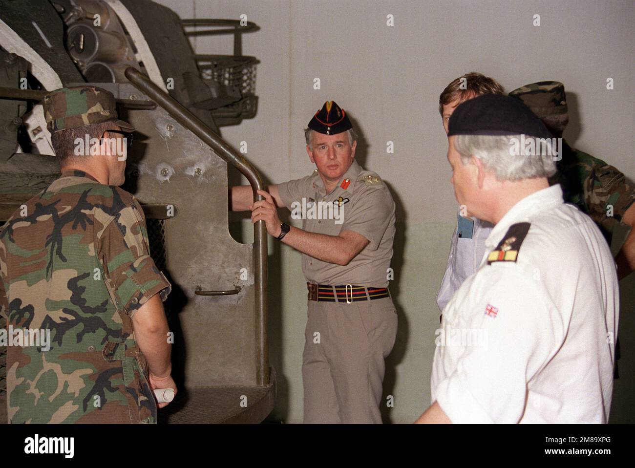 BGEN Robin D. Grist, British military attache, tours a tank turret ...
