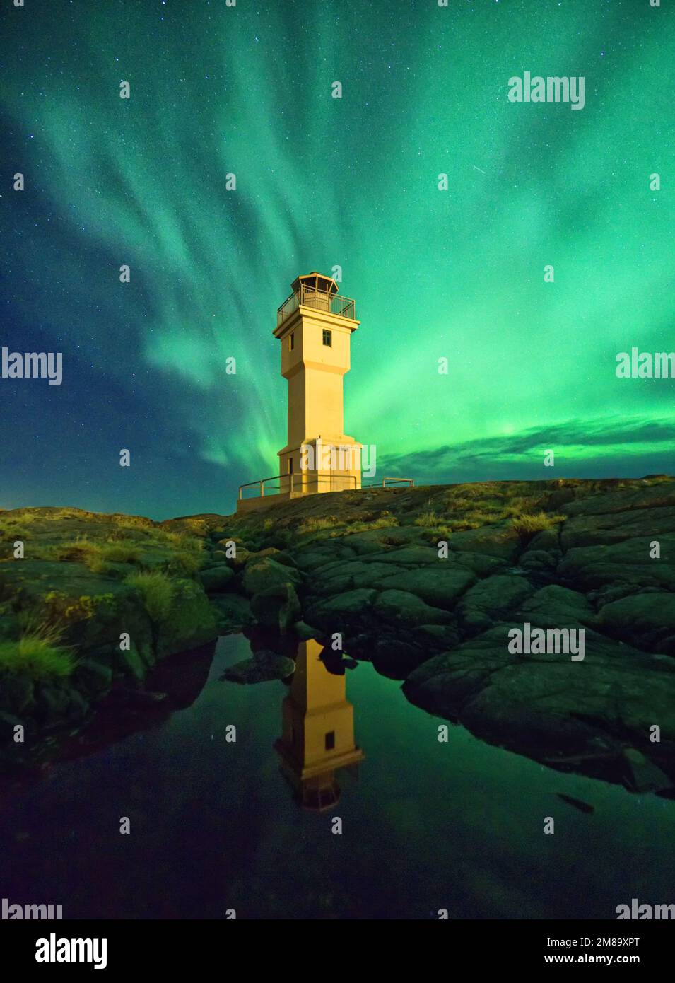 Aurora borealis (Northern Lights) above the Akranes lighthouse, Iceland ...