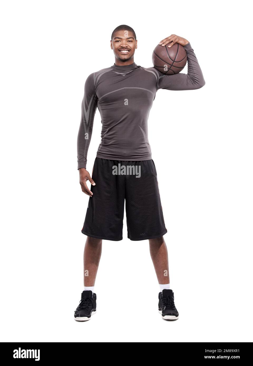 Basketball puts a smile on my face. Portrait of a handsome young ...