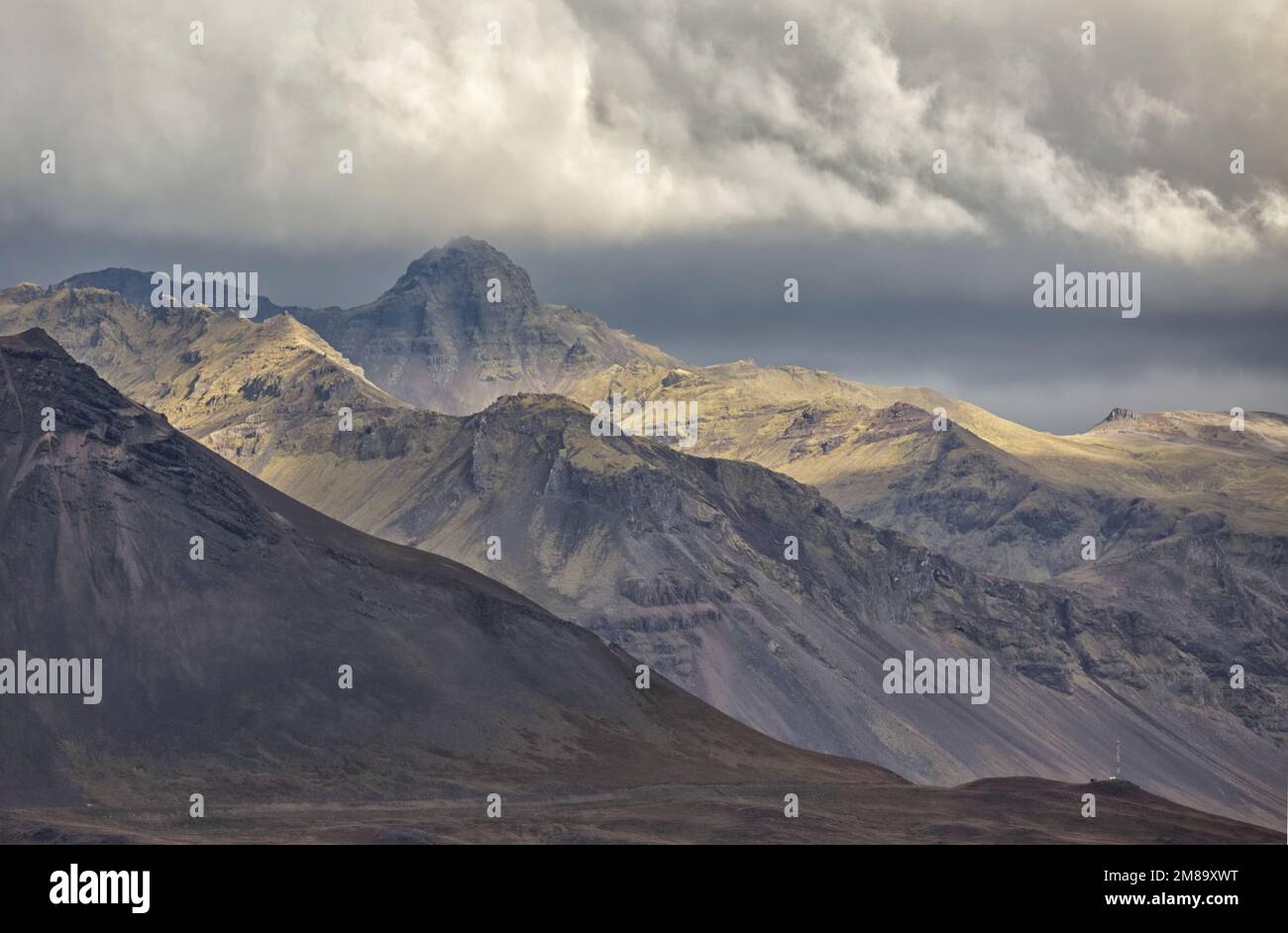 Evening light across the basalt mountains of Iceland Stock Photo - Alamy
