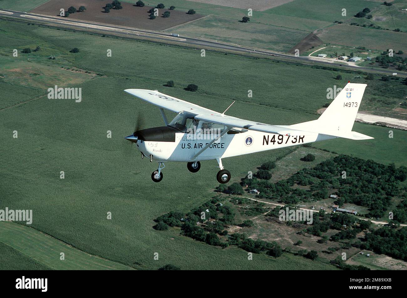 An instructor and pilot candidate fly a T-41A Mescalero trainer ...
