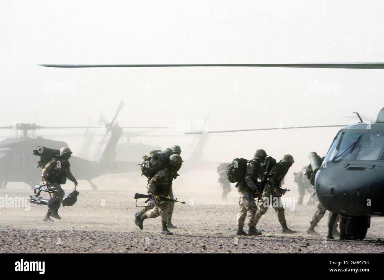 U.S. Army soldiers carrying M-61A1 rifles, some with the M203, 40mm ...