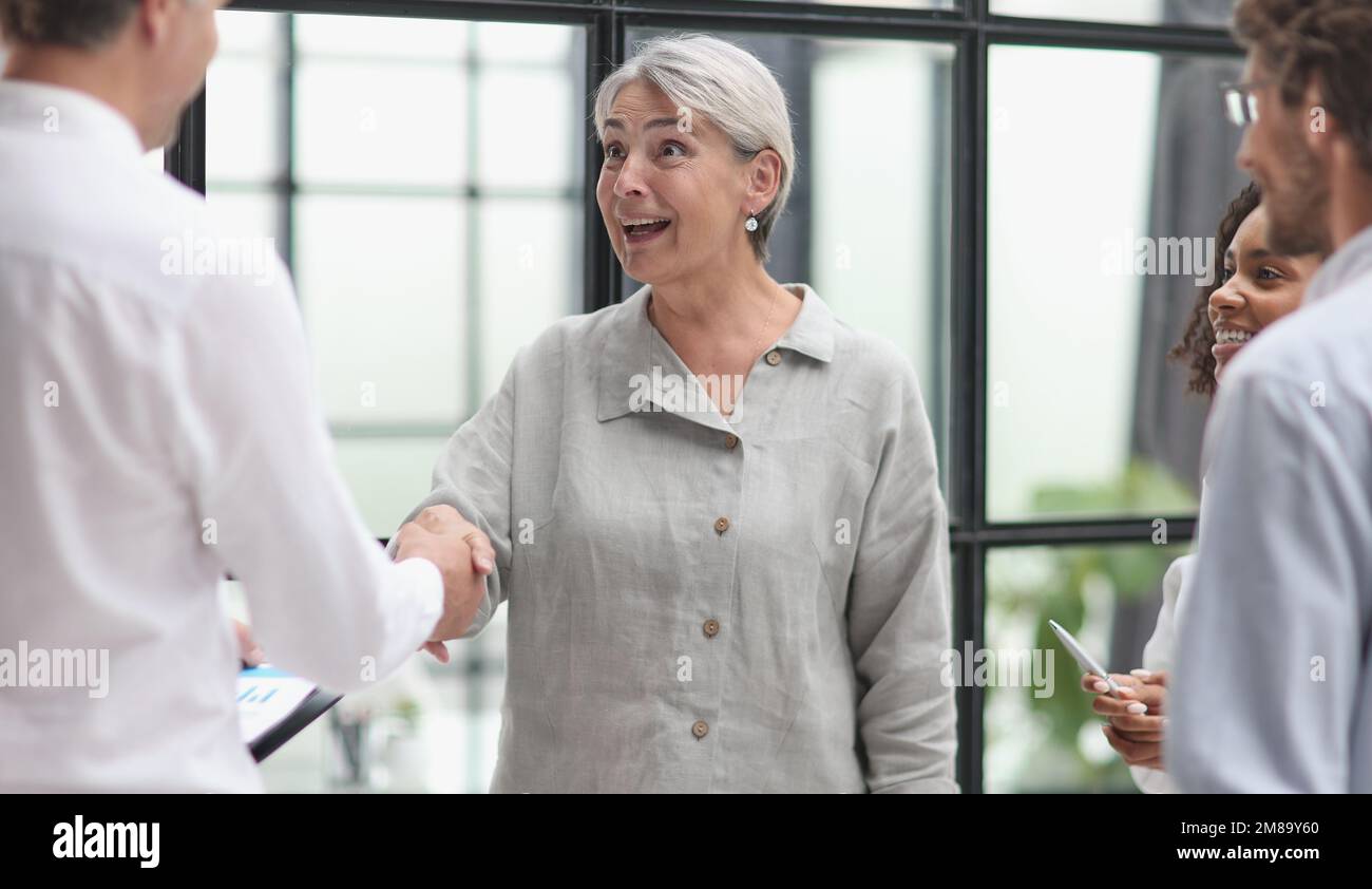 Conversation between managers and employees in the office Stock Photo ...