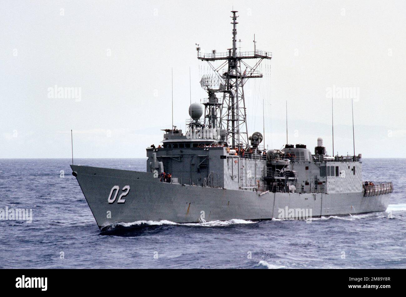 A port bow view of the Australian guided missile frigate HMAS CANBERRA ...