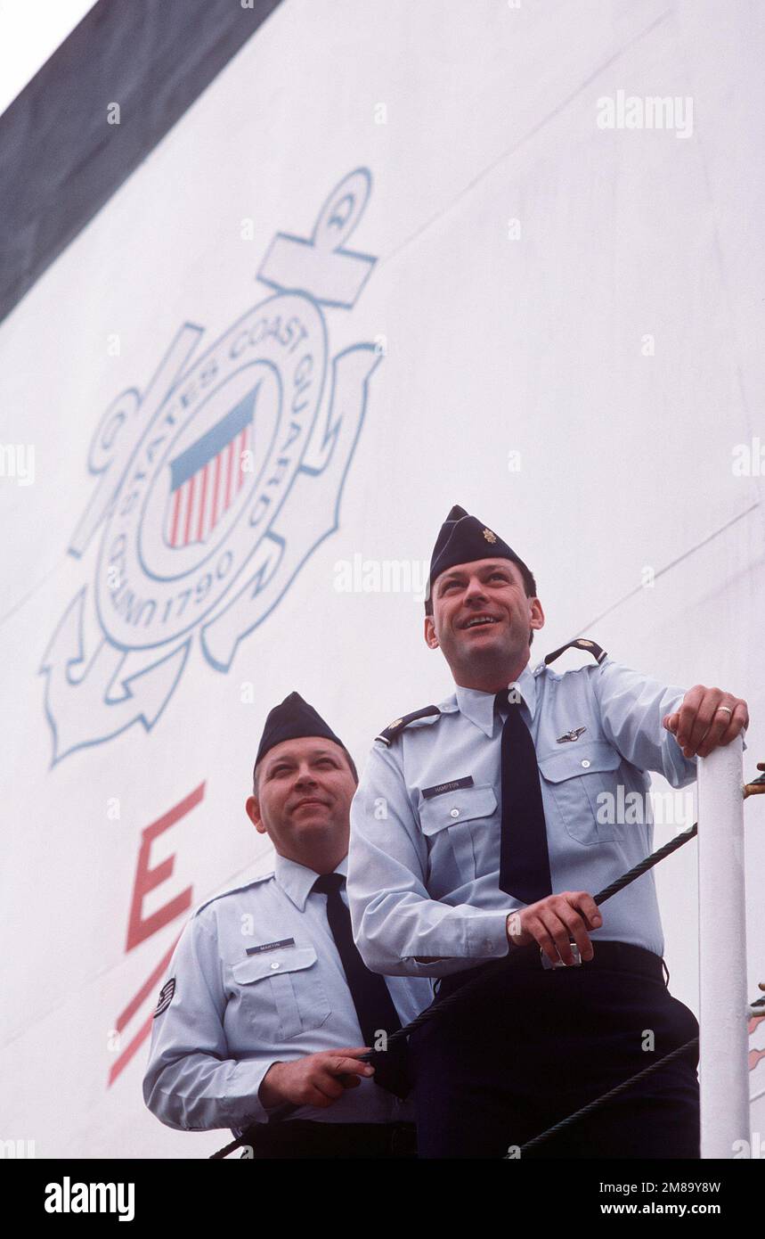MAJ Joe Hampton and TSGT David Martin, both Air Force officers, stand ...