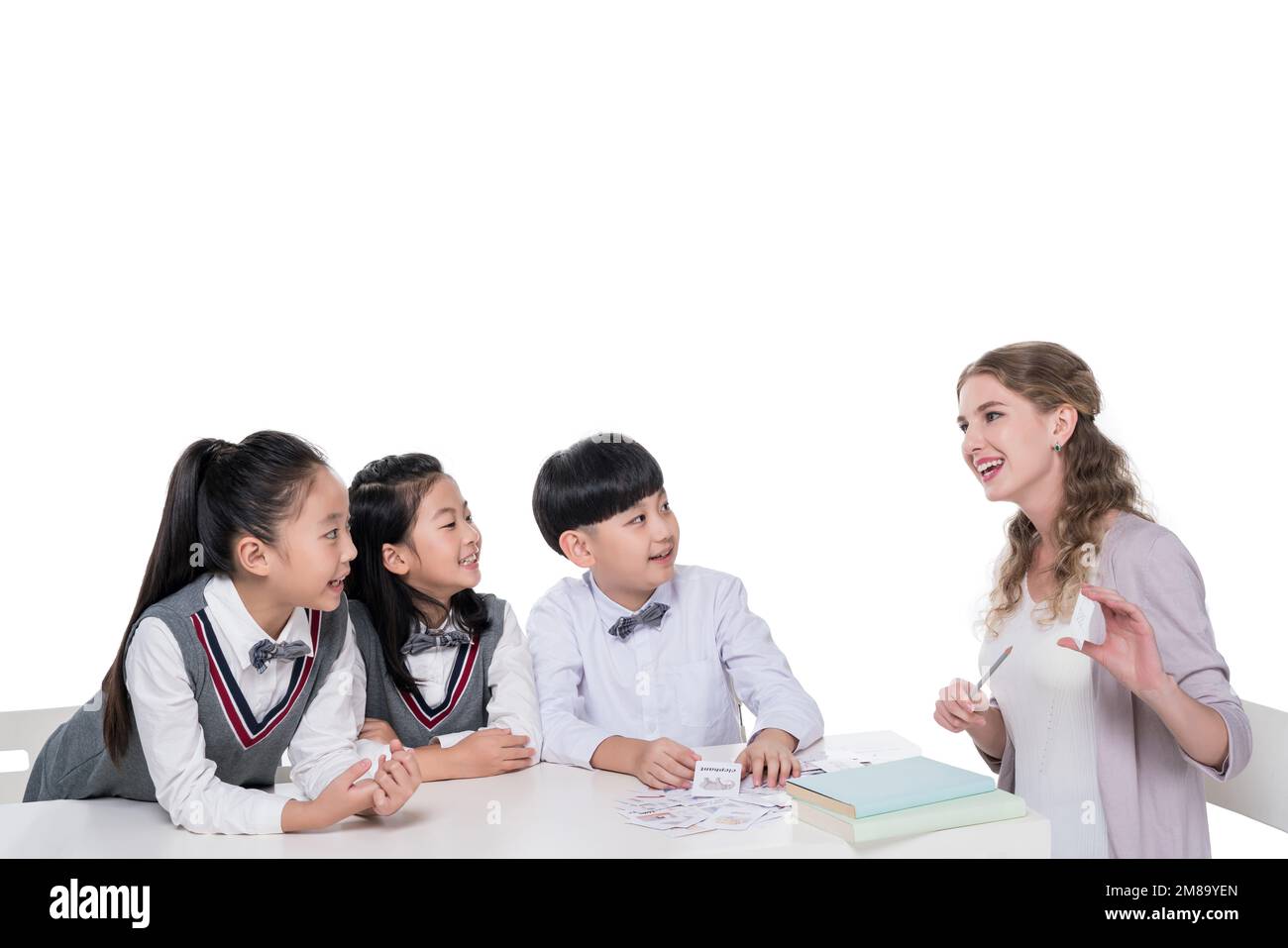 Female teachers guide students learning Stock Photo - Alamy