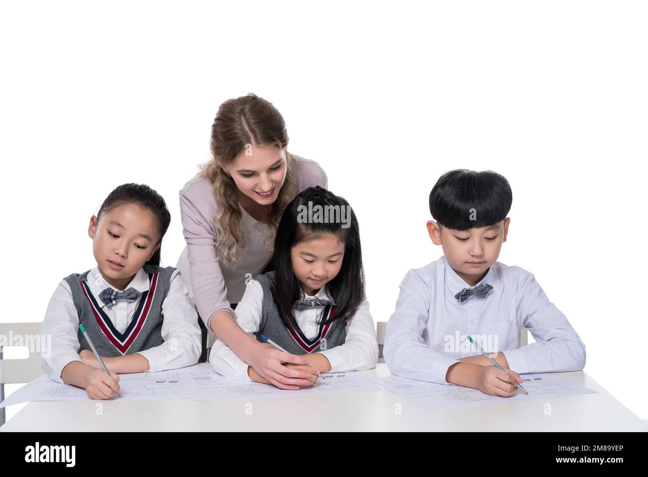 Female teachers guide students learning Stock Photo - Alamy