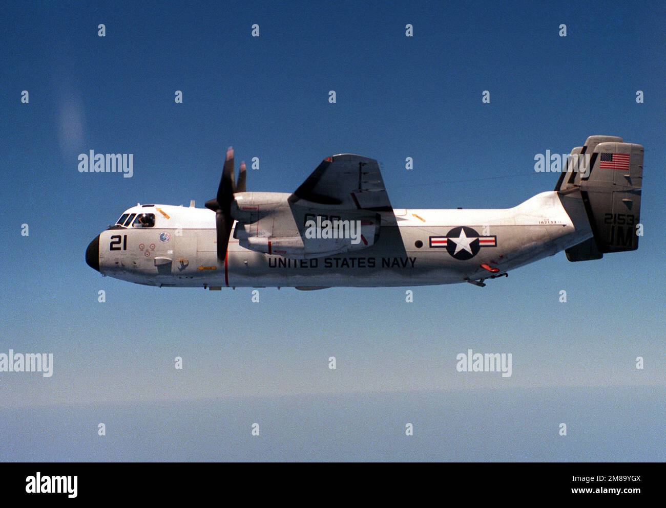 An air-to-air left side view of a C-2A Greyhound carrier on-board ...